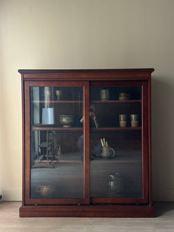 Glass sliding door display case – Good Behavior